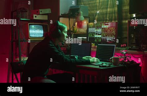 Hacker Typing On Keyboard At Night Breaking Password Using Laptop And Wearing Stock Video