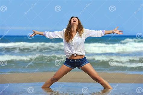 Young Attractive Woman In Shorts In Relax At Beach In Freedom Co Stock