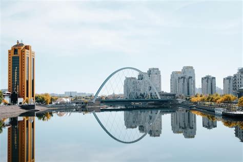 Premium Photo Karaotkel Bridge With Reflection In The Ishim River