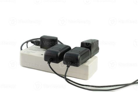 Multiple Sockets With Connected Power Strip With A Bunch Of Plugs And Adapter On White