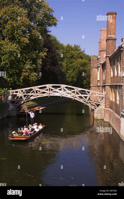 Punting On The River Cam Under The Mathematical Bridge Cambridge Stock