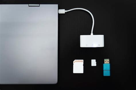 Premium Photo Laptop With Usb Typec Adapter With Pluged Usb Cables And Sd Card On Black