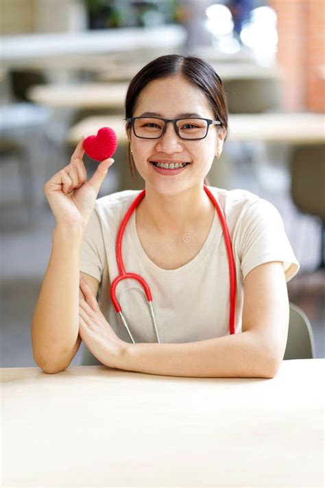 Medical Student Action Holding A Yarn Red Heart With Cute Smile On