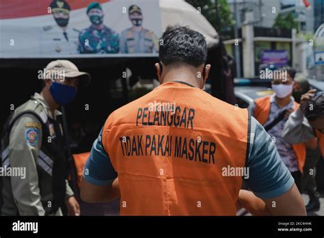 Residents Got Punishment From Security Officers For Not Wearing Mask In