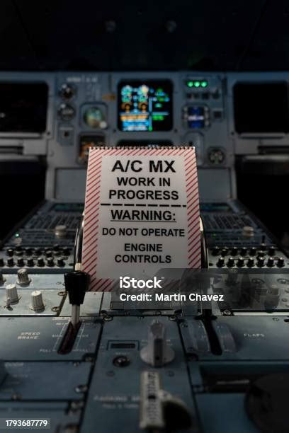 Work In Progress Sign In The Cockpit Of A Commercial Passenger Airplane
