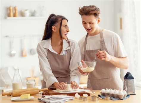Premium Photo Happy Loving Couple Is Preparing The Pastry In The Kitchen