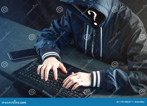 Anonymous Hacker Programmer Uses A Laptop To Hack The System St Stock