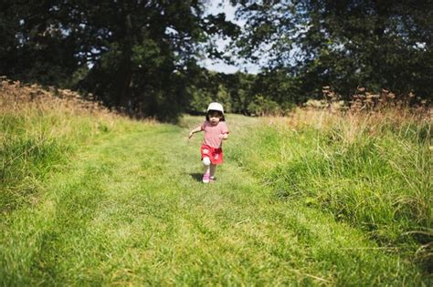 Premium Photo Full Length Of Girl On Grassy Field