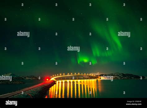 Norway Tromso Sommaroy Northern Lights Over Illuminated Bridge Stock