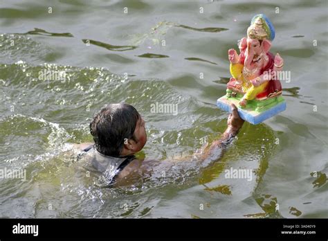 A Man With Small Idol Of Ganpati Ganpati Visarjan Jodhpur Rajasthan