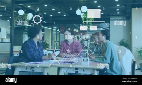 Image Of Media Icons And Processing Data Over Diverse Colleagues Discussing At Casual Office