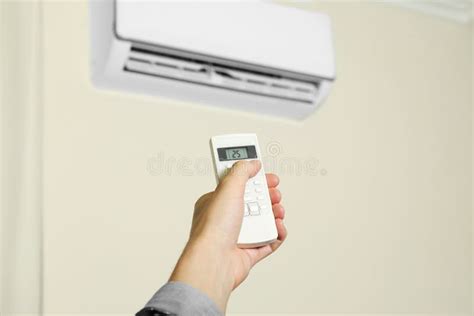 Man Operating Air Conditioner With Remote Control Indoors Closeup Stock Photo Image Of Home