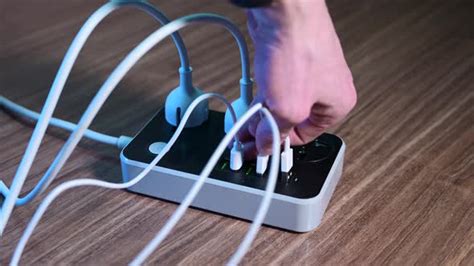 Male Hand Unplugging Cables From The Power Outlet Stock Footage VideoHive