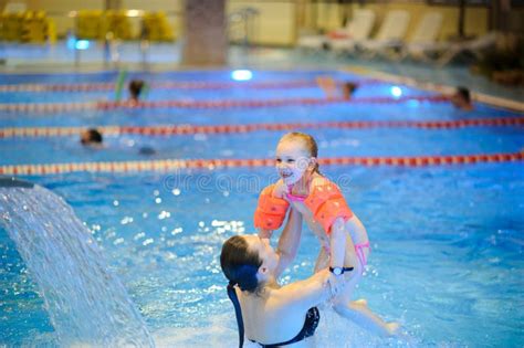 Cute Girl With Inflatables Swimming In The Pool Healthy Sport For
