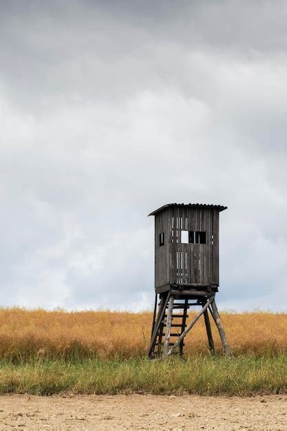 Premium Photo Built Structure On Field Against Sky