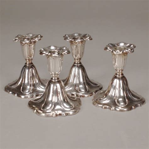 Lot 072 Four Weighted Sterling Silver Candlesticks By Lebkuecher And Co