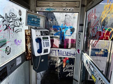Vintage Phone Booth In Nazare Portugal Covered With Graffiti And Urban