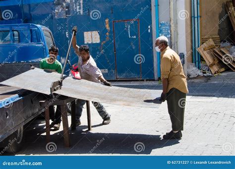 Workers Cutting Grass In A Park Editorial Photo