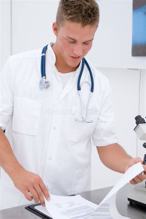 Young Scientist Looking At Data Sheet Results Stock Image Image Of