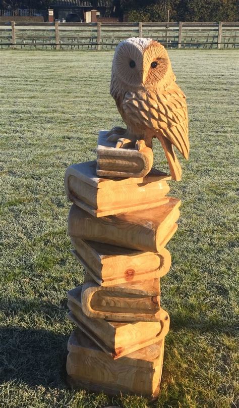 Chainsaw Carved Owl On Books Out Of Spruce On A Frosty Morning