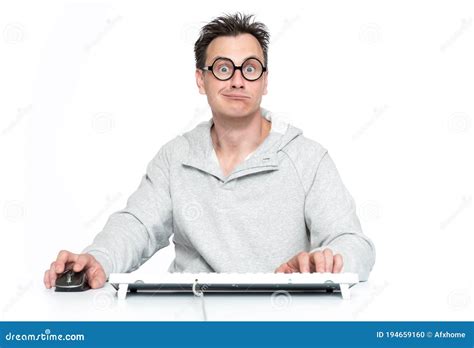 Funny Programmer Man With Keyboard In Front Of Computer Stock Image