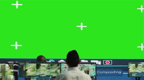 Courier Agency Operators Monitoring Cargo Shipment With A Greenscreen