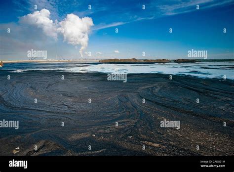 Oil Industry Pollution Tailings Settling Pond With Residual Crude Oil
