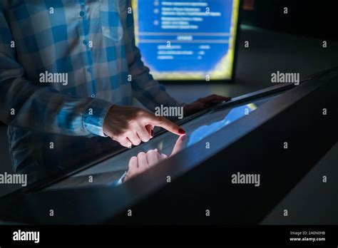 Woman Using Multimedia Touchscreen Display Of Interactive Kiosk Stock Photo Alamy
