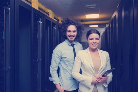 Engineer Showing Working Data Center Server Room To Female Chief