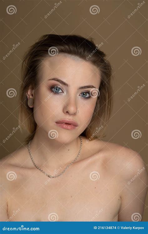 Sexual Girl With Heterochromia Nose Piercing And Plug In One Ear Stock Photo Image Of Eyeball