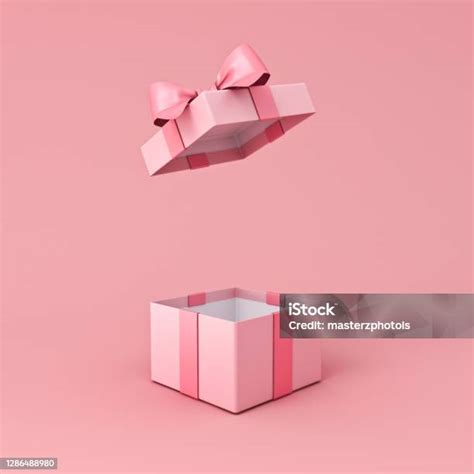 빈 오픈 핑크 선물 상자 또는 핑크 리본 리본 리본 그림자 최소한의 개념으로 밝은 핑크 오렌지 파스텔 색상 배경에 고립 된 선물