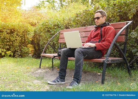 Young Man Working On His Laptop Connect To Wireless Internet In Rural Area Internet Connection