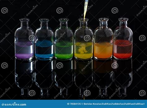 Apothecary Laboratory Bottles With Colored Liquid And Pipette Stock
