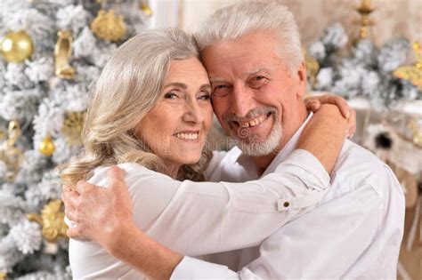 Couple Old And Mature Seniors Enjoying And Having Fun Together Celebrating The New Year Stock