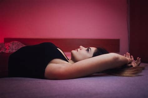 Premium Photo Woman Lying Down On Bed