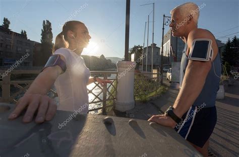 Jogging Couple Planning Running Route And Setting Music Stock Photo Shock 110912294