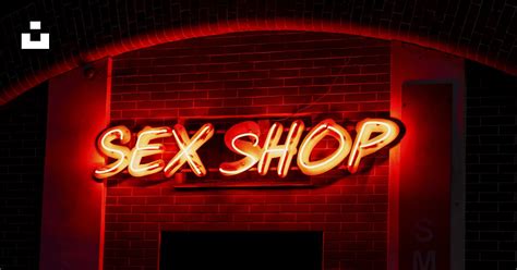 A Neon Sign That Reads Sex Shop On A Brick Wall Photo Free Sex Shop Image On Unsplash