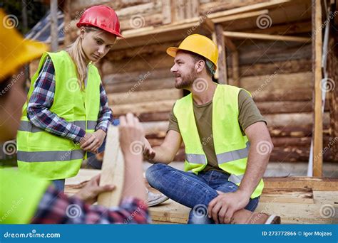 Young Construction Workers Man And Woman Talkingteamworkbuilding