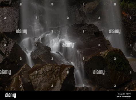 Detail Of Water Cascading Onto Rocks At The Bottom Of A Waterfall Stock