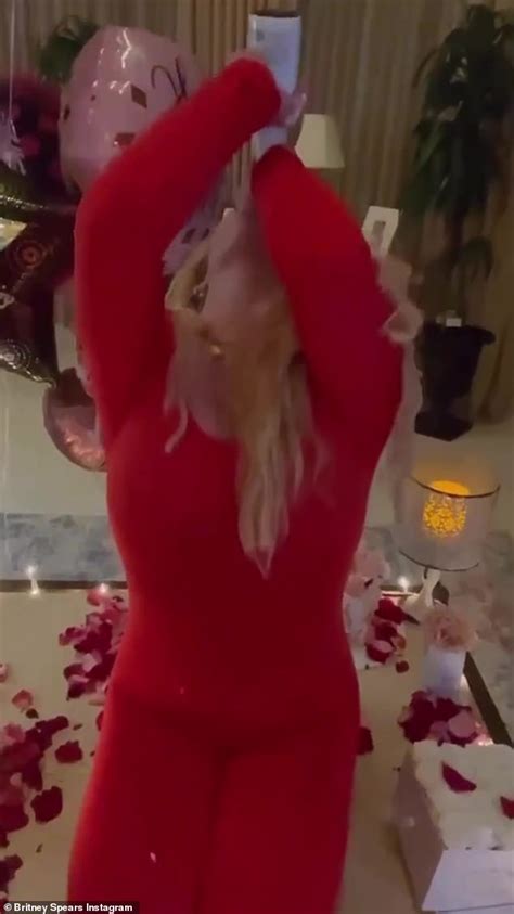 Britney Spears Slips Into A Sexy Red Bodysuit As She Recreates Outfit From Famous Music Video