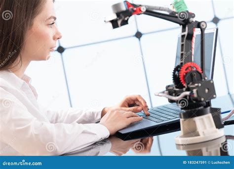 A Young Woman Writes An Algorithm For The Robot Arm Science Research