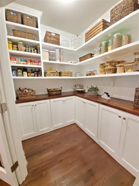 Organized Pantry With White Cabinets And Wood Flooring Cozy Kitchen