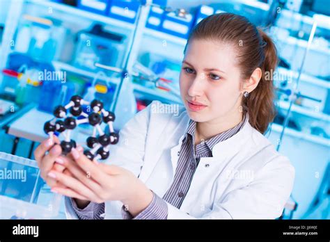 Woman In Lab With Molecular Model Kit Stock Photo Alamy