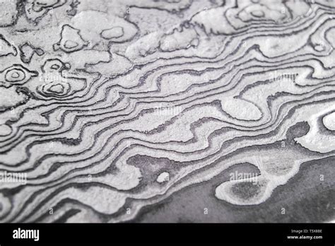 Background With Pattern Of Damask Steel Close Up Macro Shot Of A