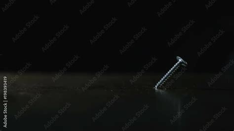 Screw Is On A Dark Background Hammer Hits The Screw It Bends Close