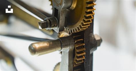 기어 연동 복잡한 기계 설계를 보여줍니다 사진 Unsplash의 무료 기계 이미지