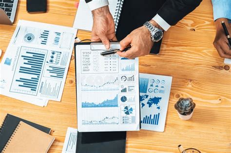 Top View Diverse Analyst Team Analyzing Financial Data Meticulous