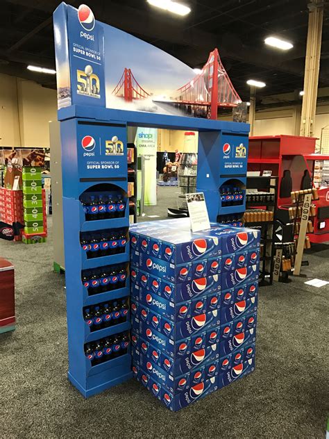 A Display In A Store Filled With Boxes Of Soft Drinks And Pepsi Sodas