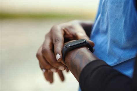 Premium Photo Player Checking Fitness Tracker