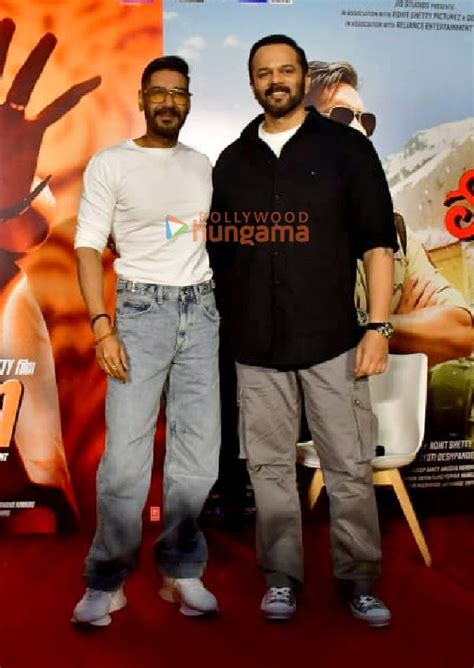 Photos Ajay Devgn And Rohit Shetty Snapped At A Multiplex Screening Singham Part 1 To Interact